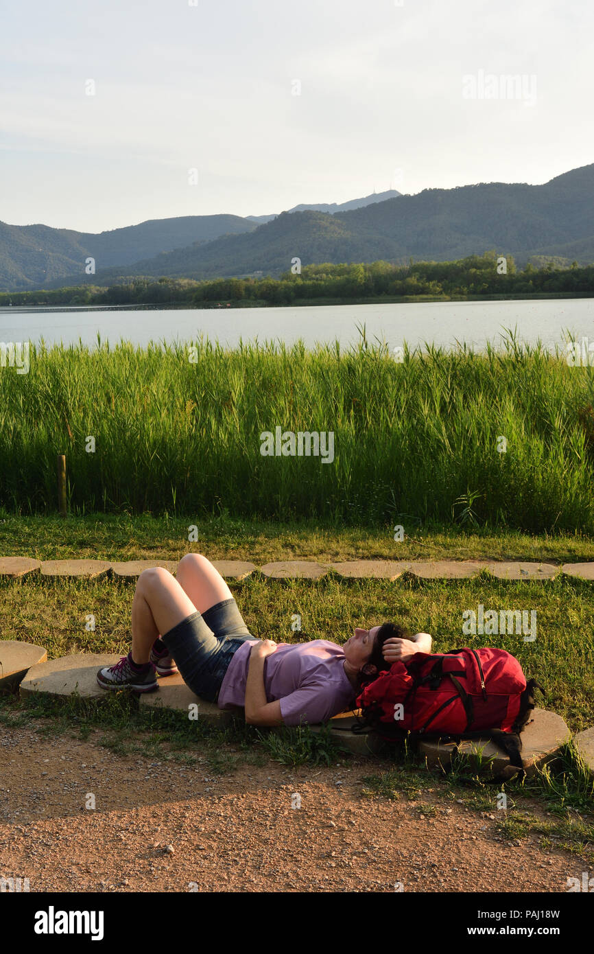 Hiker woman resting after walking Stock Photo - Alamy