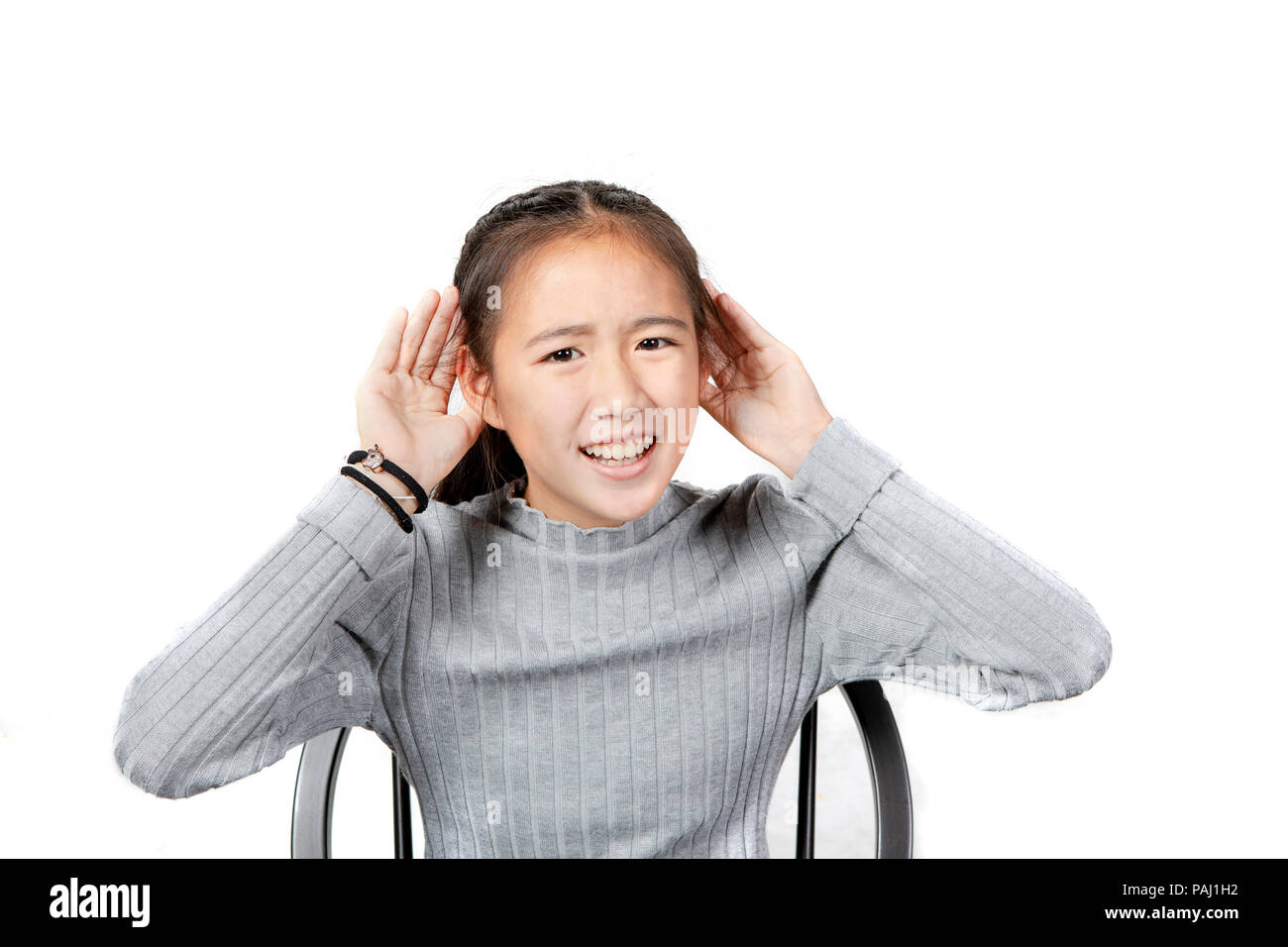 asian teenager raise hand up to hearing isolated white background Stock ...