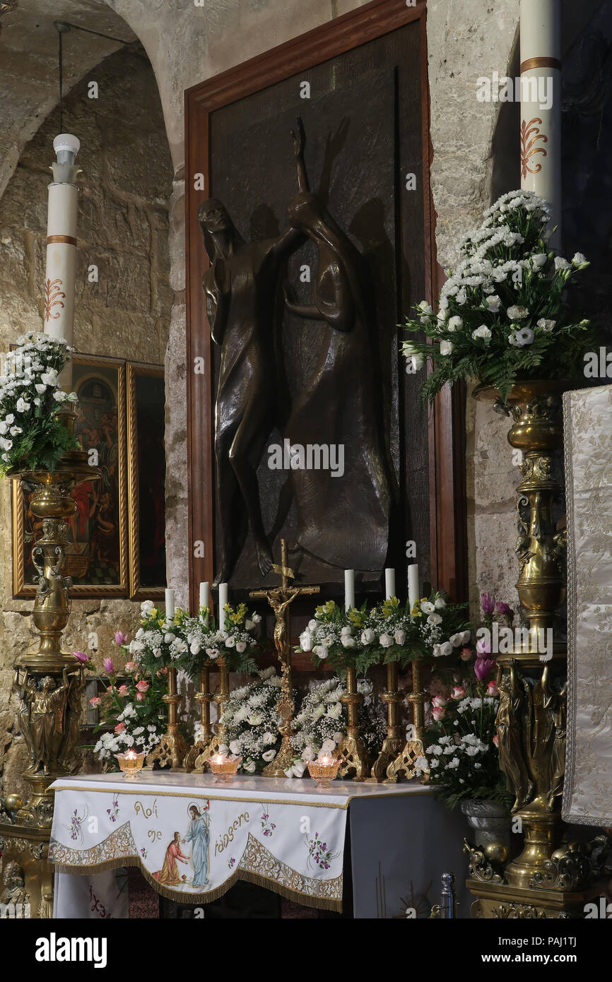 Flowers decorating candlesticks at the Chapel of Mary Magdalene inside ...