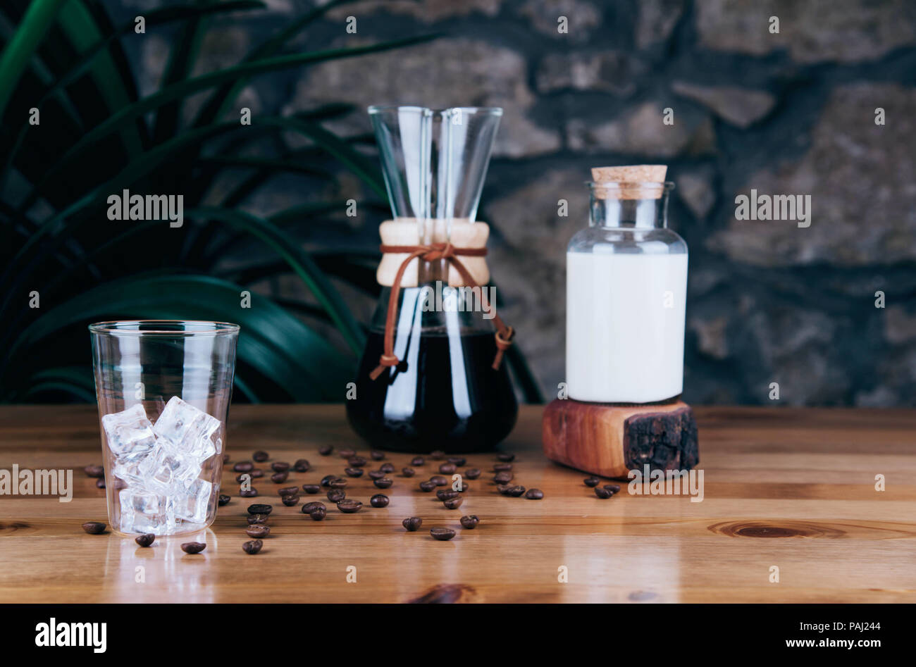 Cold brew iced coffee in glass and coffee beans on trendy background ...