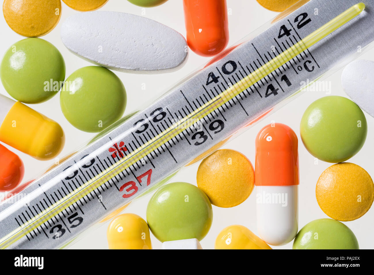 clinical thermometer and tablets, disease and medication, Pills - Close ...