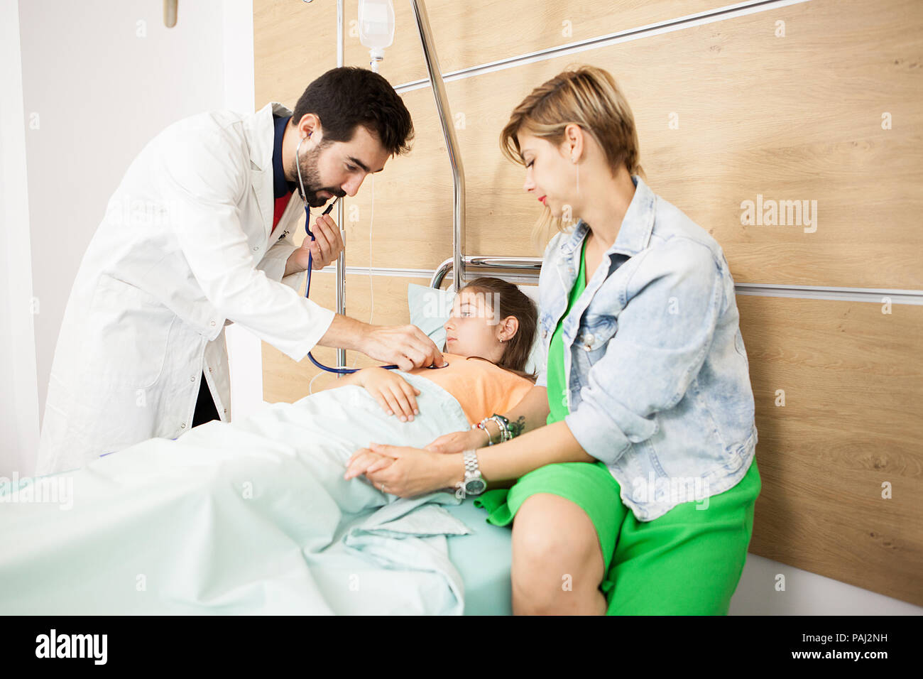 Doctor checking her patient heart in hospital Stock Photo - Alamy