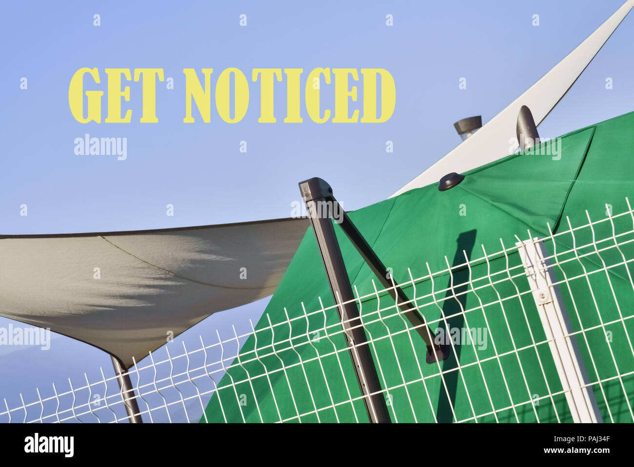 Text Get Noticed written on a background with interesting shapes Stock ...