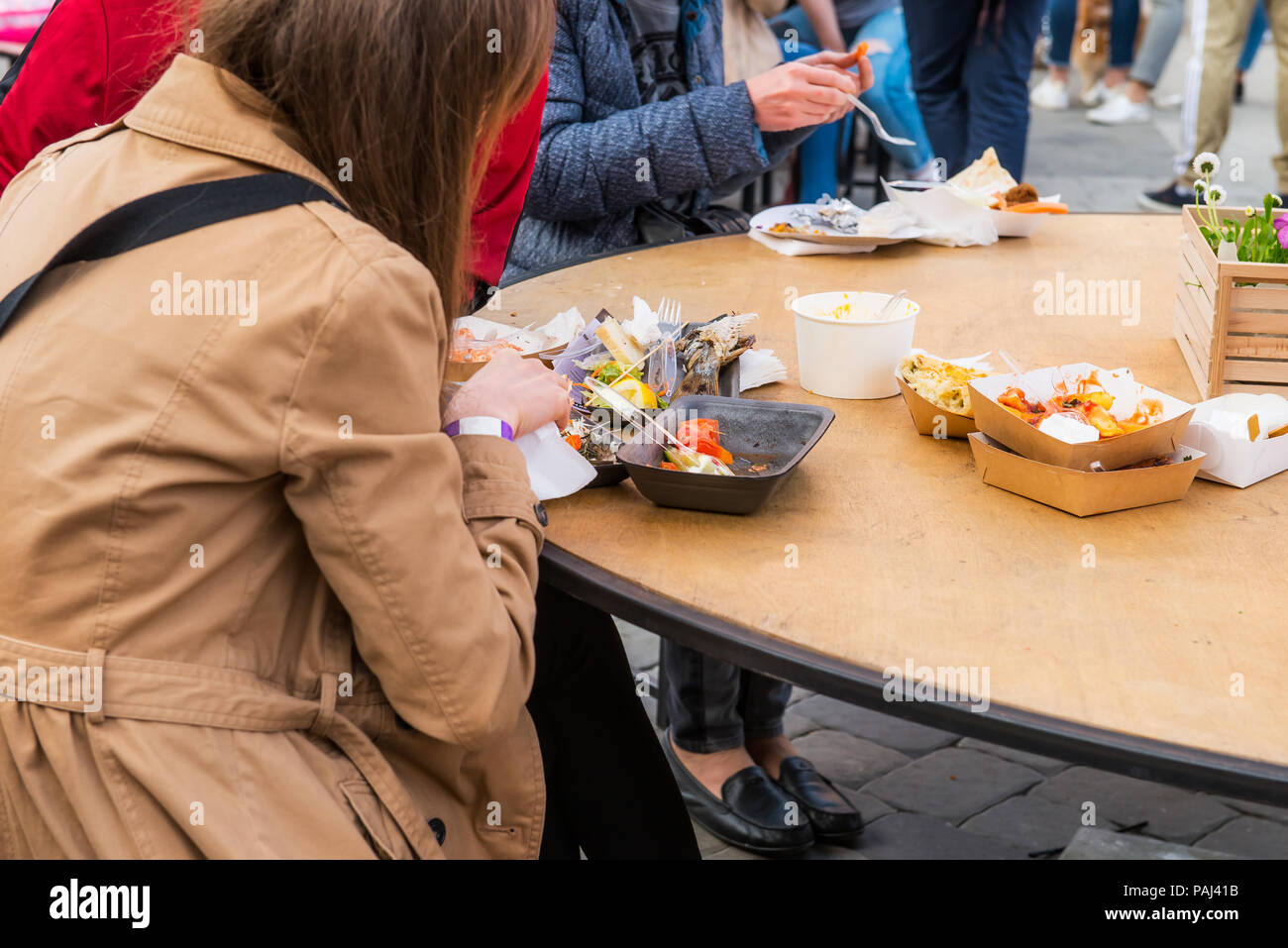 Back view woman eating table cafe hi-res stock photography and images ...