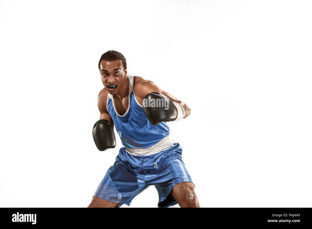 Sporty man during boxing exercise. Photo of boxer on white background ...
