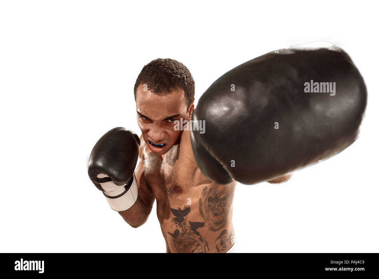 Sporty man during boxing exercise. Photo of boxer on white background ...