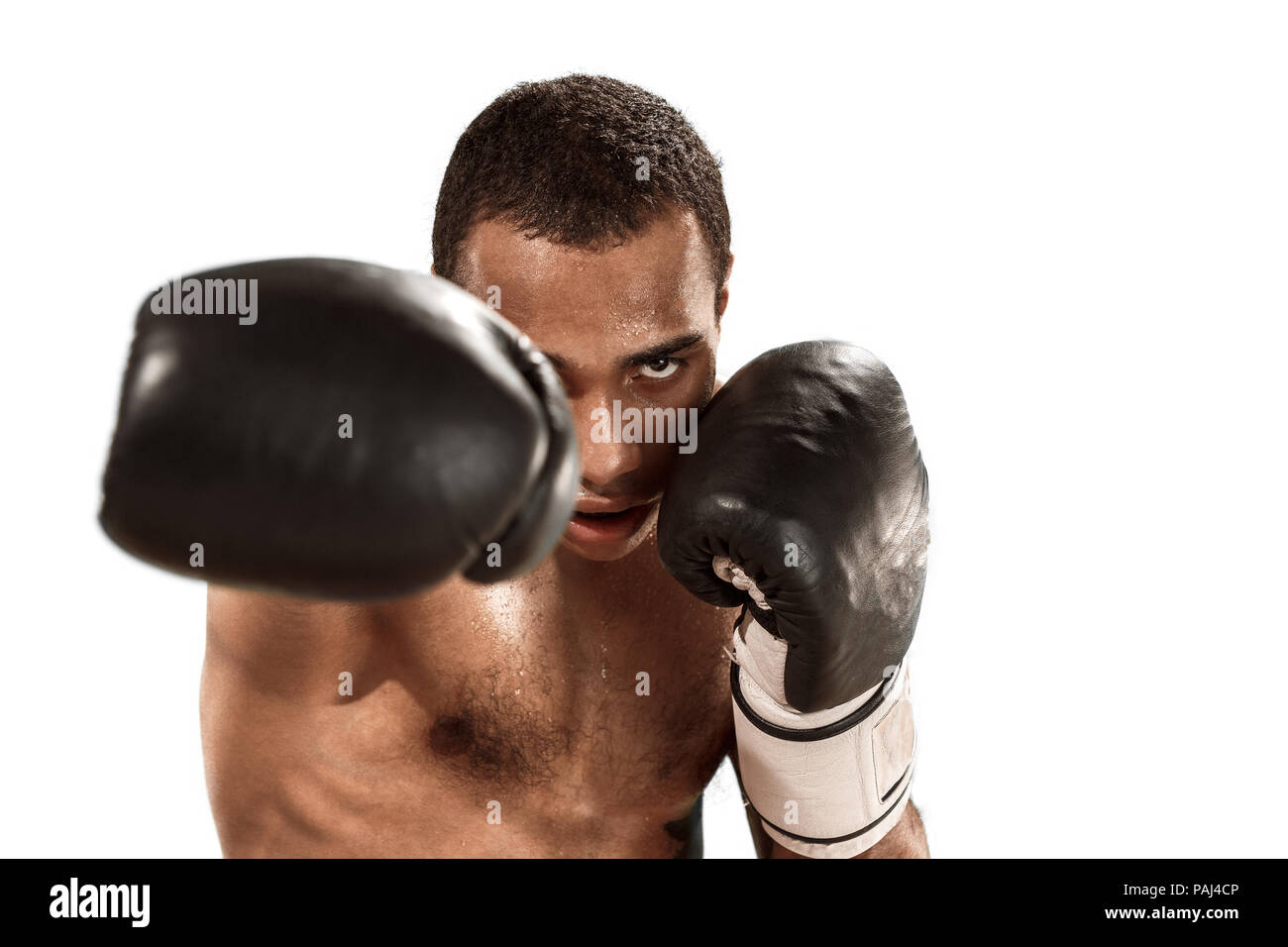 Sporty man during boxing exercise. Photo of boxer on white background ...