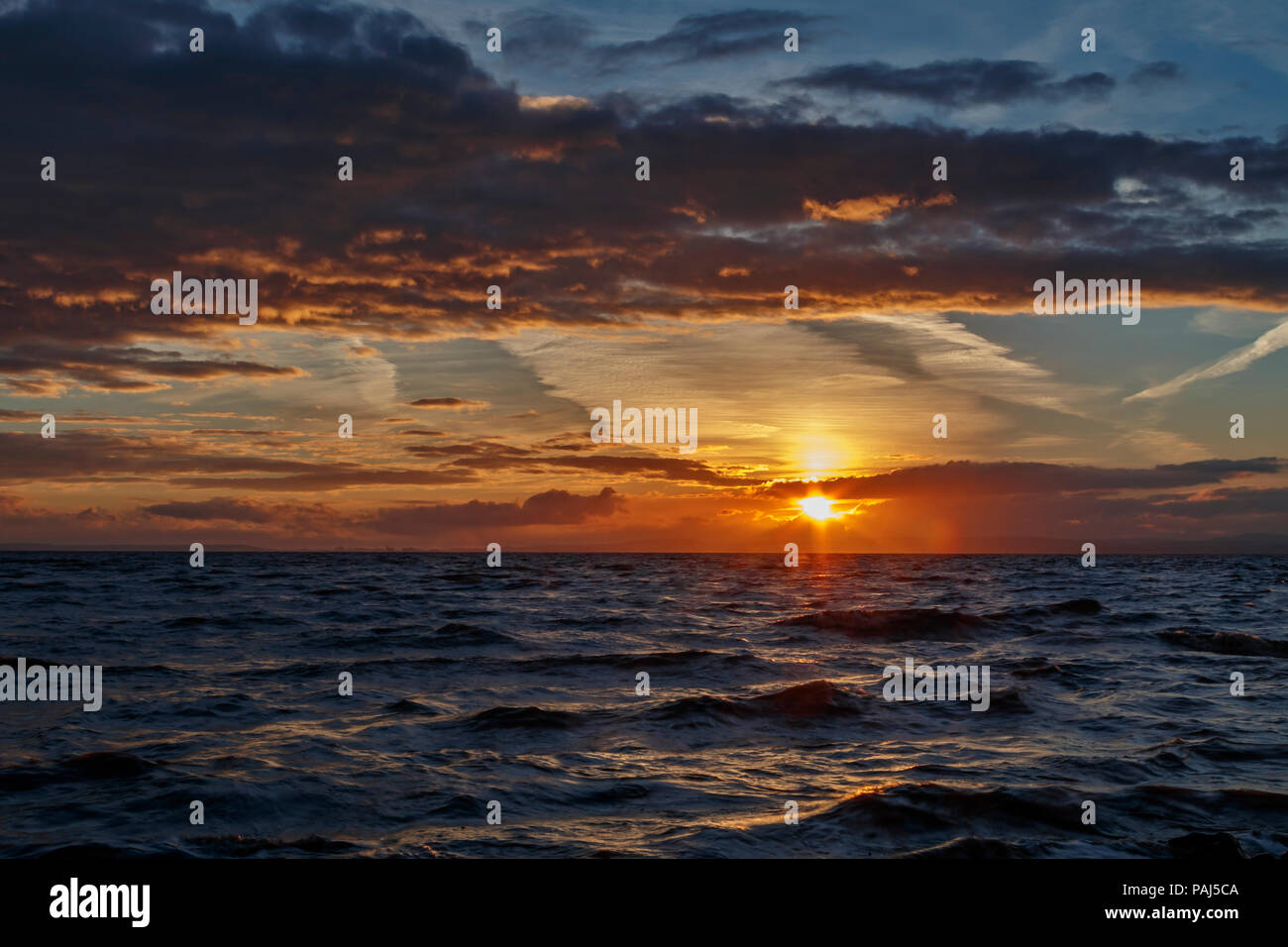 The sun setting over the Welsh hills Stock Photo - Alamy