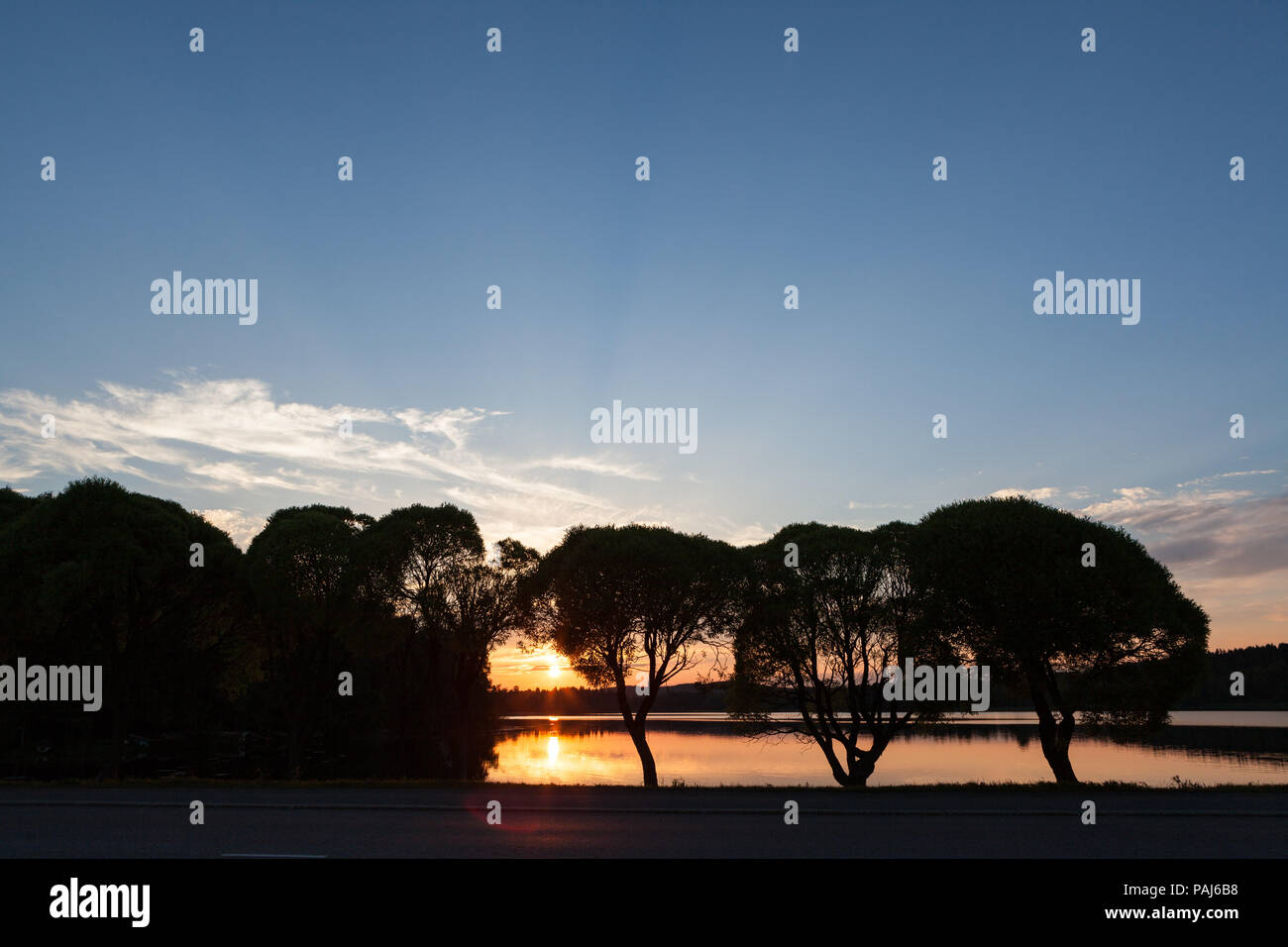 Sunset at lakeside Stock Photo - Alamy