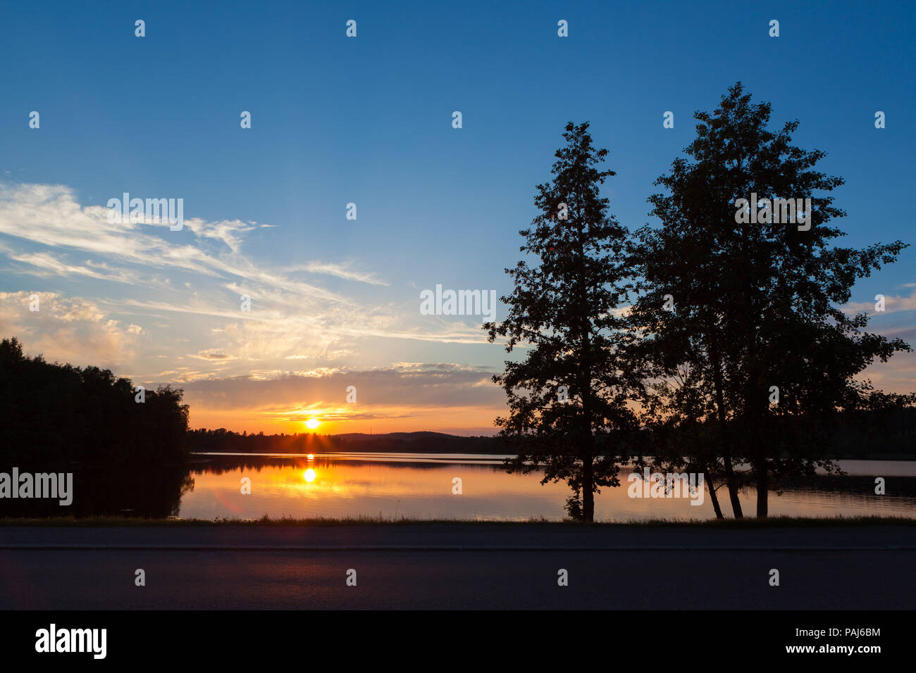 Sunset at lakeside Stock Photo - Alamy