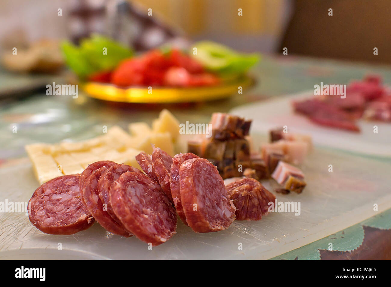 Serbian breakfast with sliced domestic sausage, bacon, ham and cheese ...