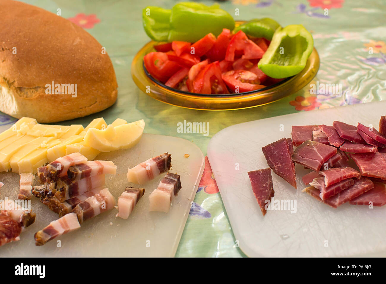 Serbian breakfast with sliced domestic sausage, bacon, ham and cheese ...