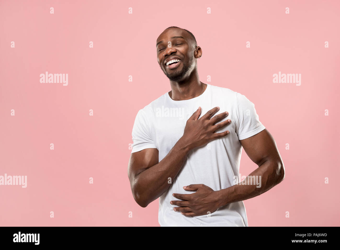 The happy business man standing and smiling Stock Photo - Alamy