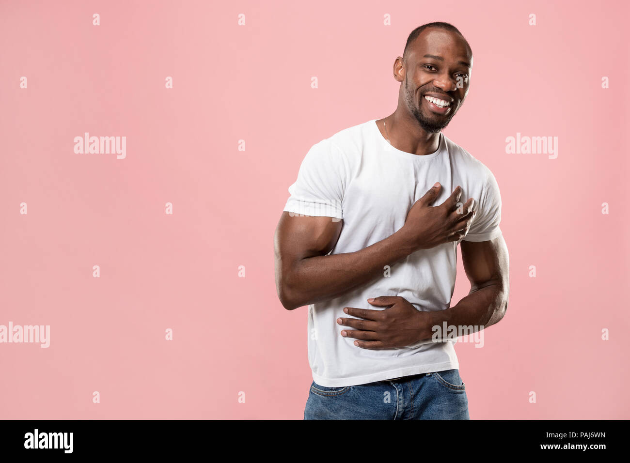 The happy business man standing and smiling Stock Photo - Alamy