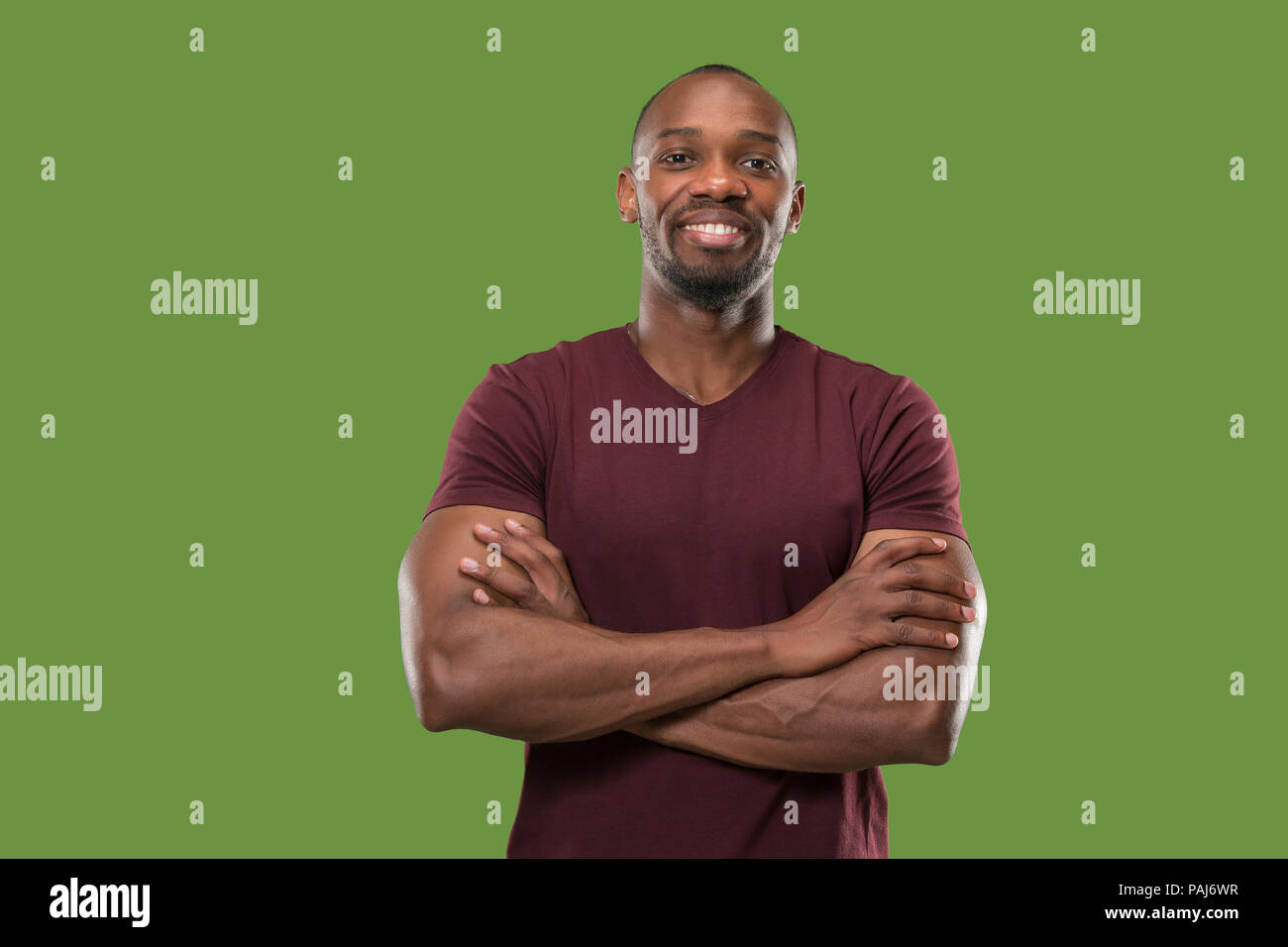 The happy business man standing and smiling Stock Photo - Alamy