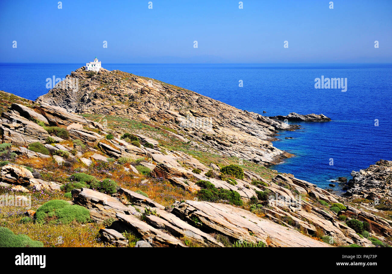 Summer natural landscape with white lighthouse on cape of Paros island ...