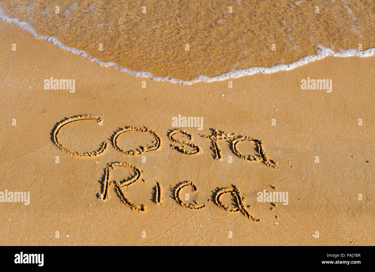 Costa rica word on sandy beach, travel background Stock Photo - Alamy