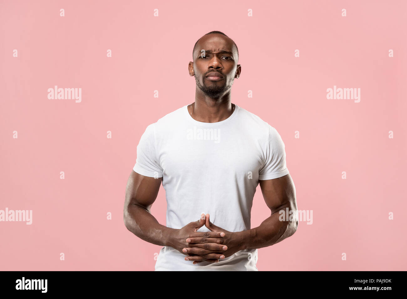 The serious businessman standing and looking at camera Stock Photo - Alamy