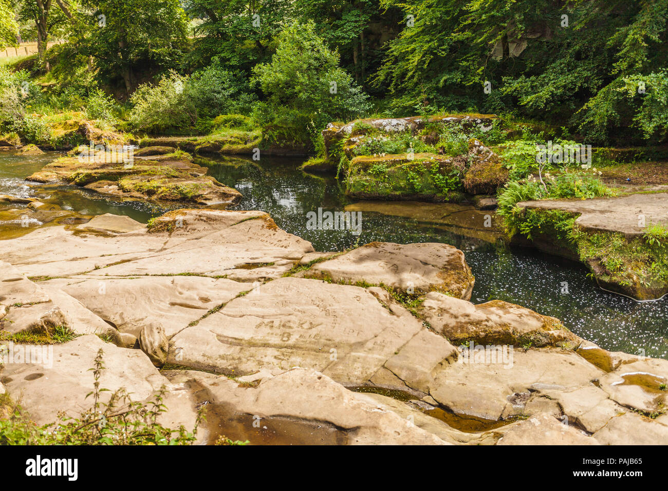 The River Coquet flowing through the centre of Rothbury,Northumberland ...
