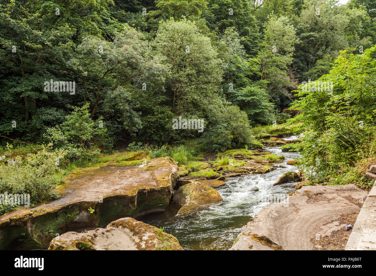 The River Coquet flowing through the centre of Rothbury,Northumberland ...
