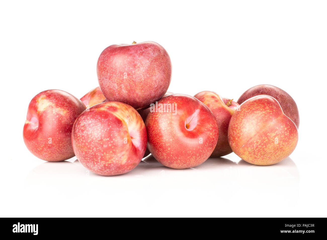 Lot of whole fresh pluot interspecific plums variety stack isolated on ...