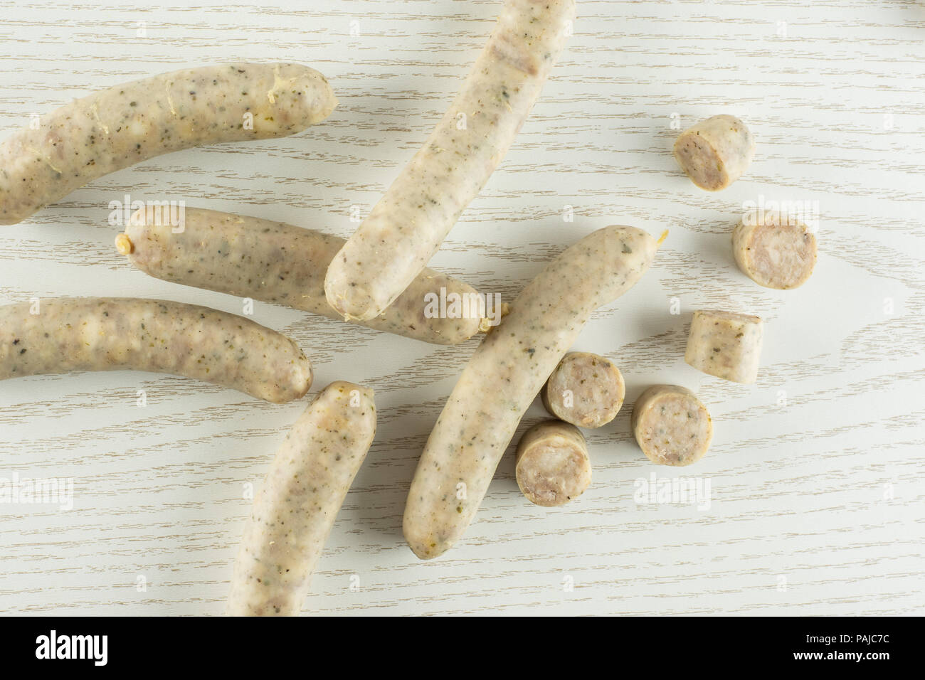 Lot of whole lot of slices of bavarian white sausage stack flatlay on ...