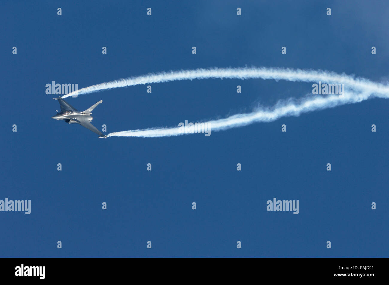 aerobatic flying-display with white smoke at the 2005 Paris AirShow ...