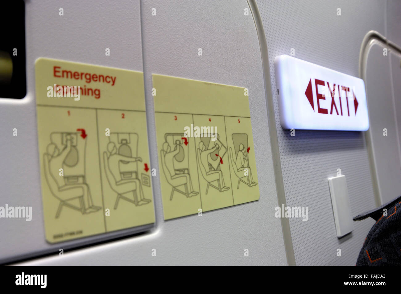 signs and instructions on the emergency-exit Stock Photo - Alamy