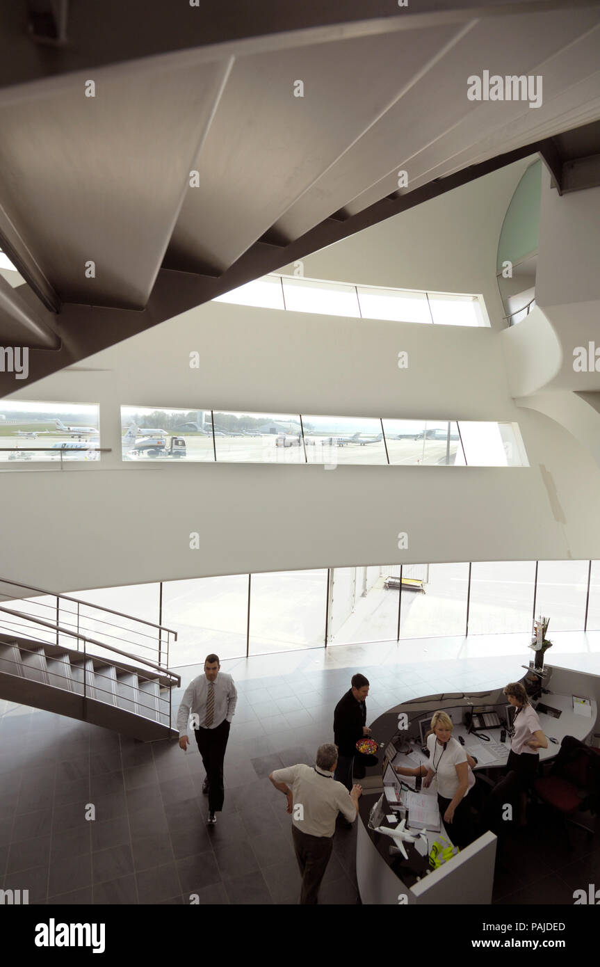 stairs, windows, men and women at the reception desk in the TAG ...