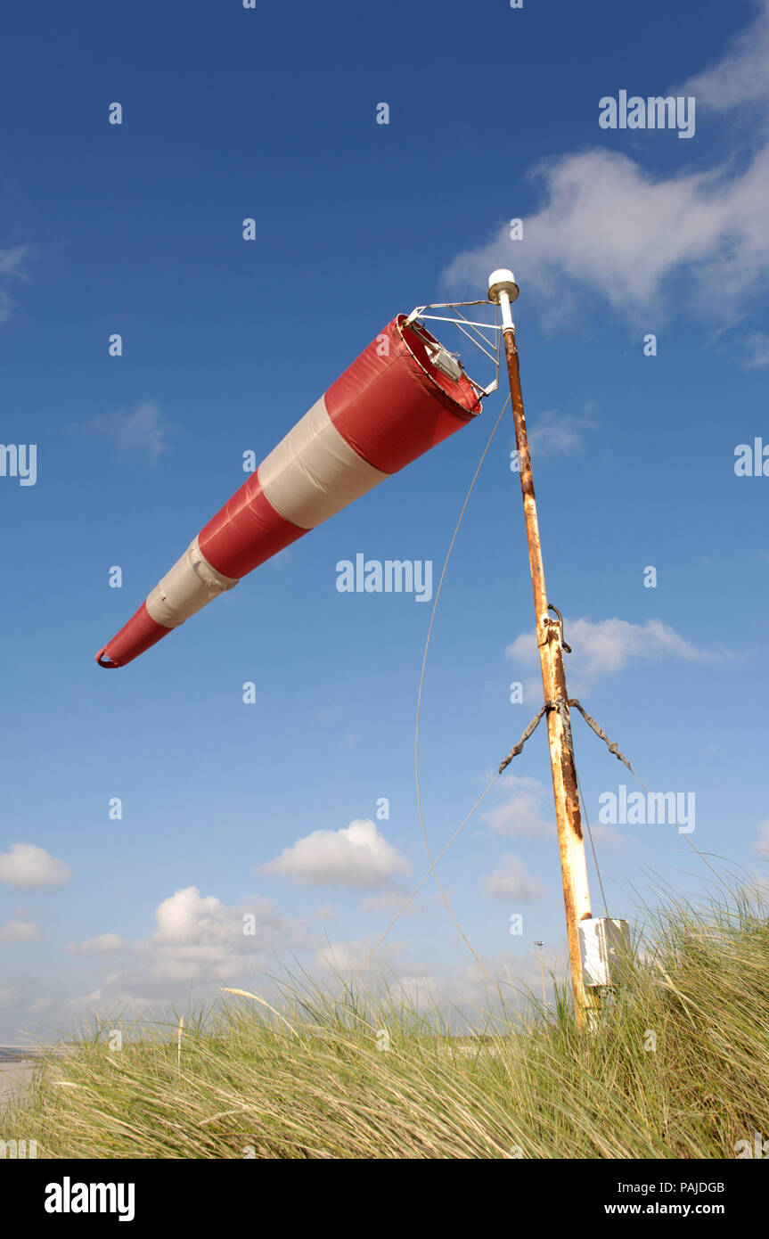 windsock during moderate wind with clouds and grass Stock Photo - Alamy