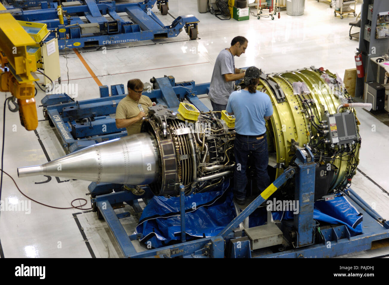 engineers working on a CFM-56-7B engine on the production-line Stock ...