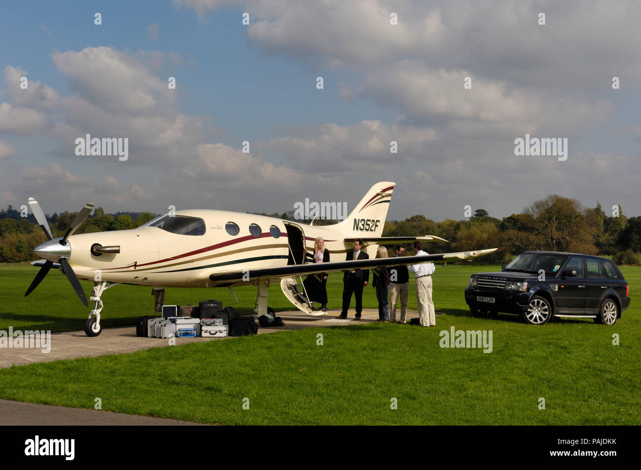 passengers boarding the Farnborough F1 Kestrel with luggage and a Range ...