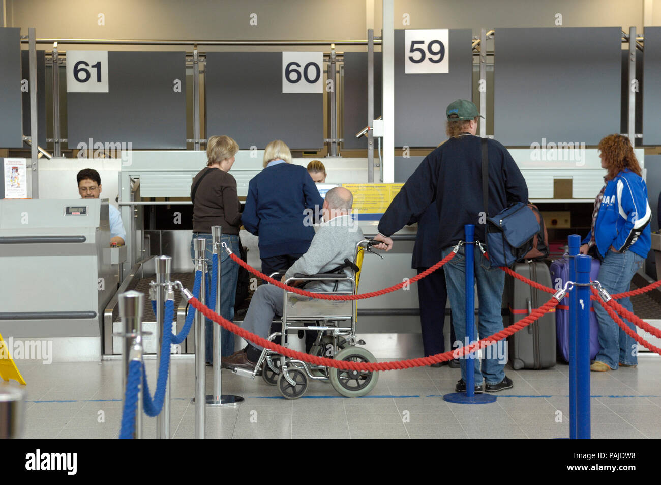 passengers checking-in at British Airways self-service check-in kiosks ...