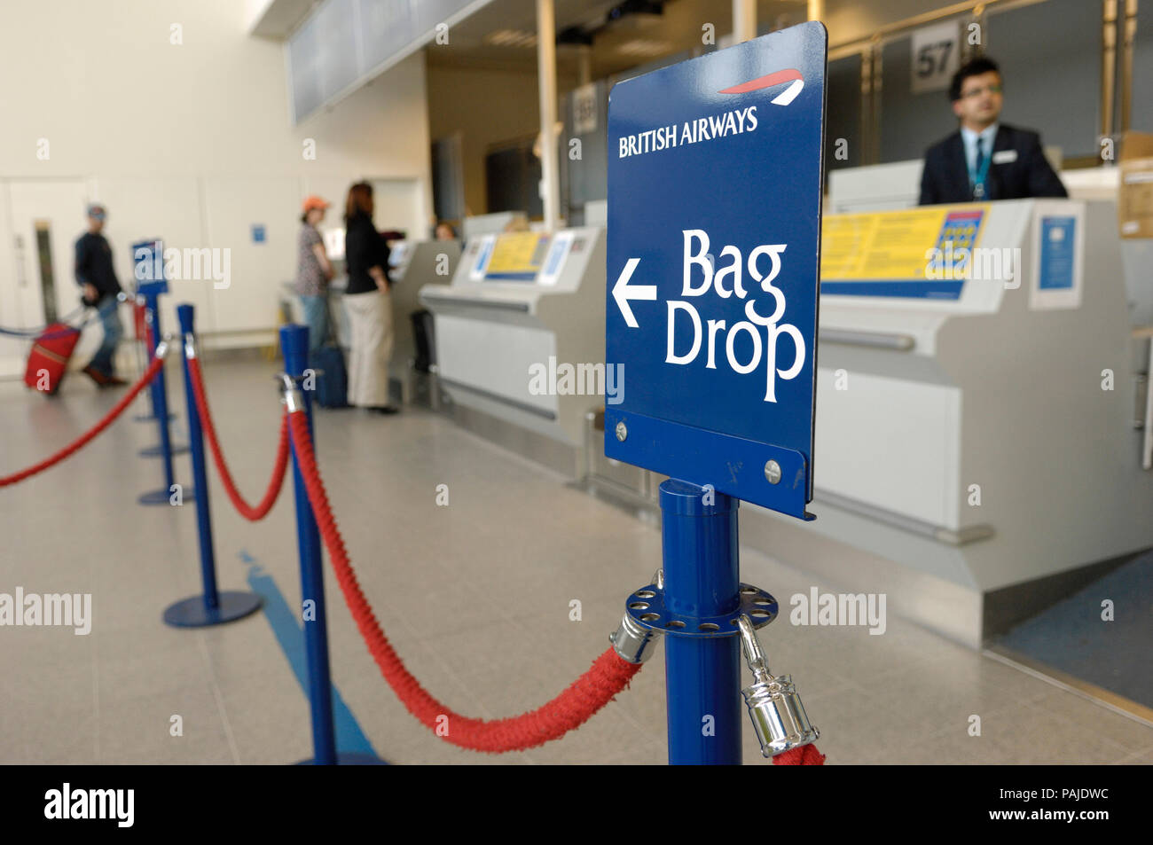 passengers checking-in at British Airways self-service check-in kiosks ...