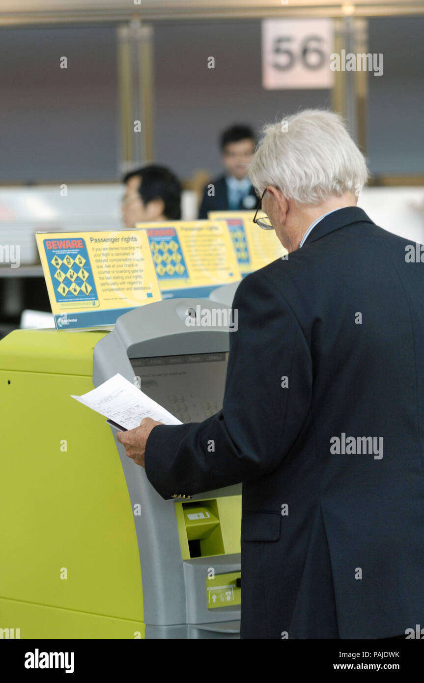 passengers checking-in at British Airways self-service check-in kiosks ...