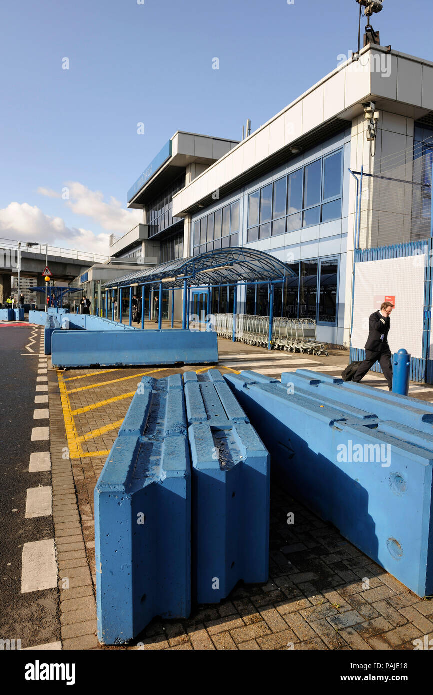 blue security barriers outside the terminal Stock Photo - Alamy