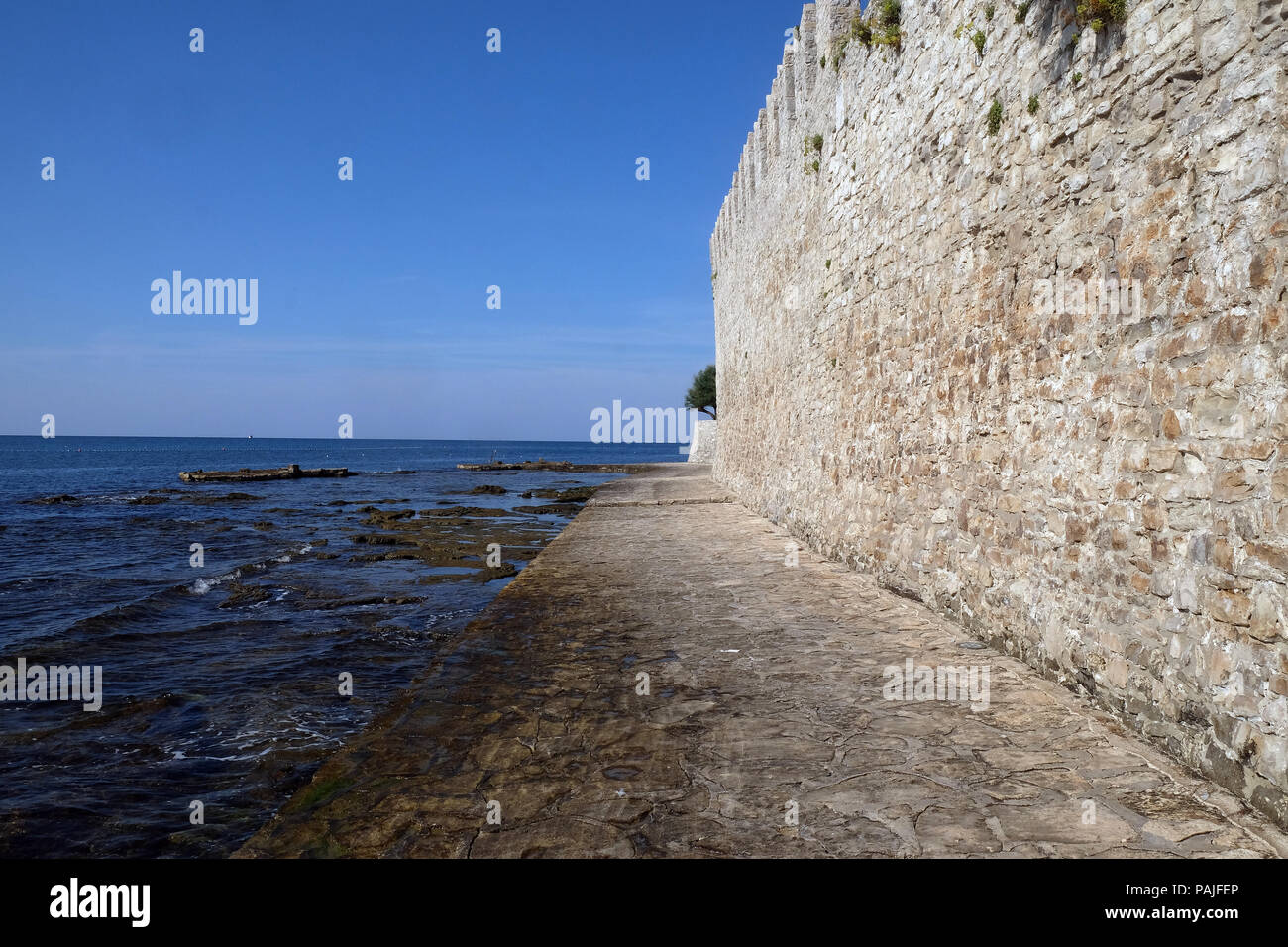 Beach in the small idyllic city Novigrad located on the west coast of ...