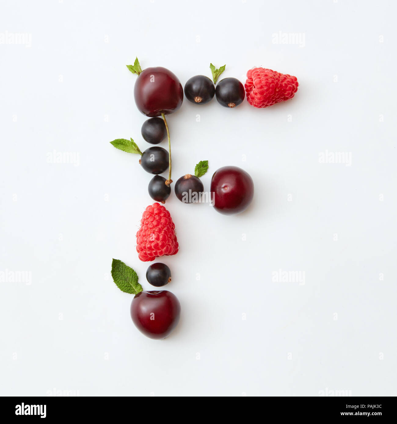 Fruits pattern of letter F english alphabet from natural ripe berries ...