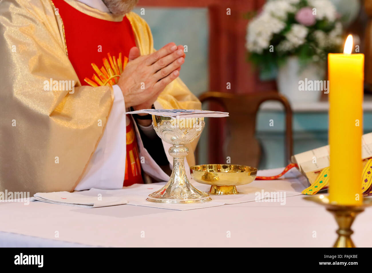 Priest celebrate mass at the church Stock Photo - Alamy