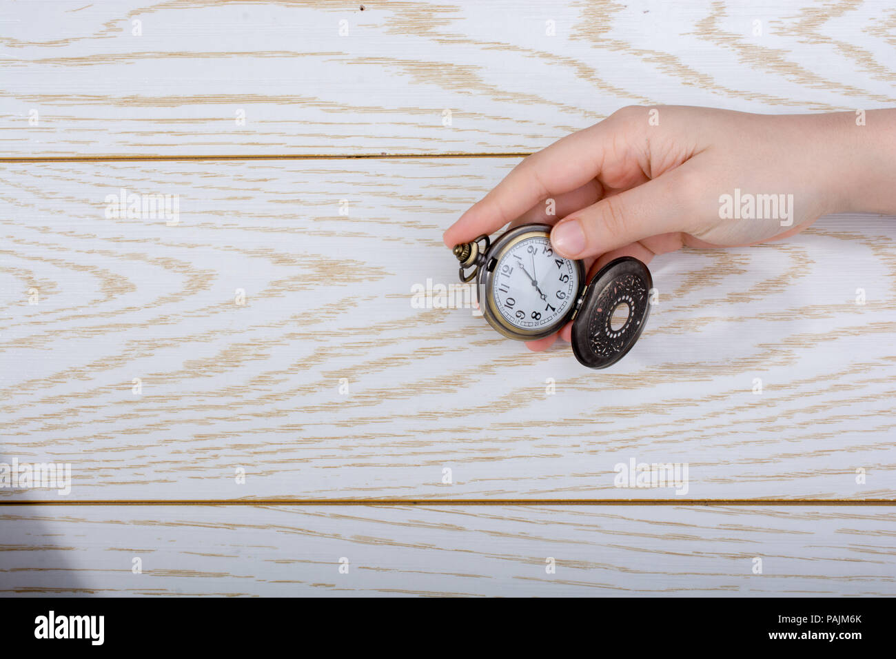Pocket watch in hand hi-res stock photography and images - Alamy