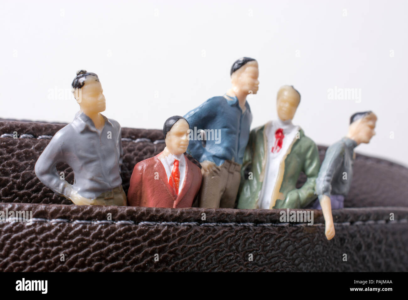 Tiny figurine of group of men miniature model in pockets Stock Photo ...