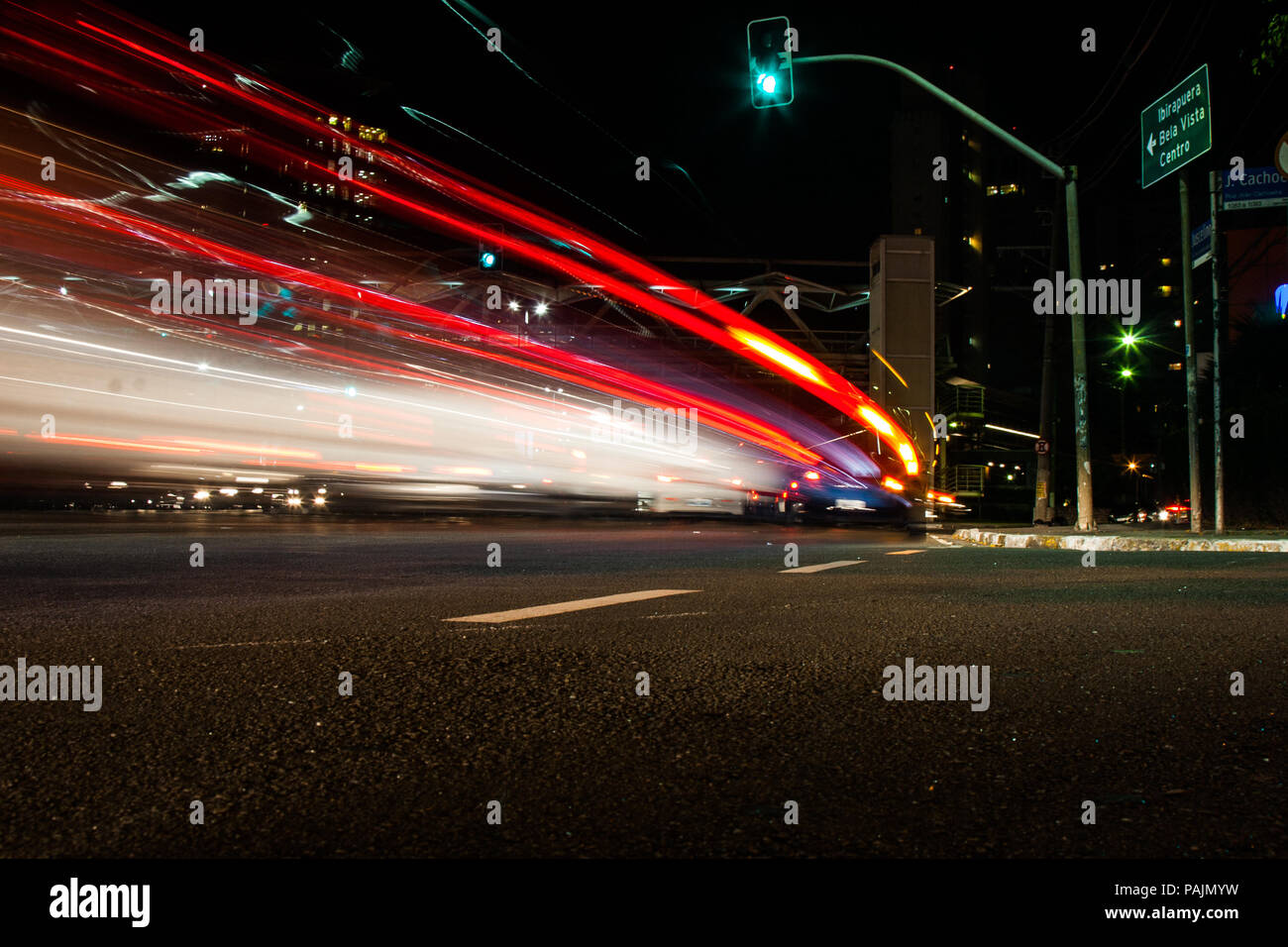 Light trails of vehicle in a street with green traffic light Stock ...
