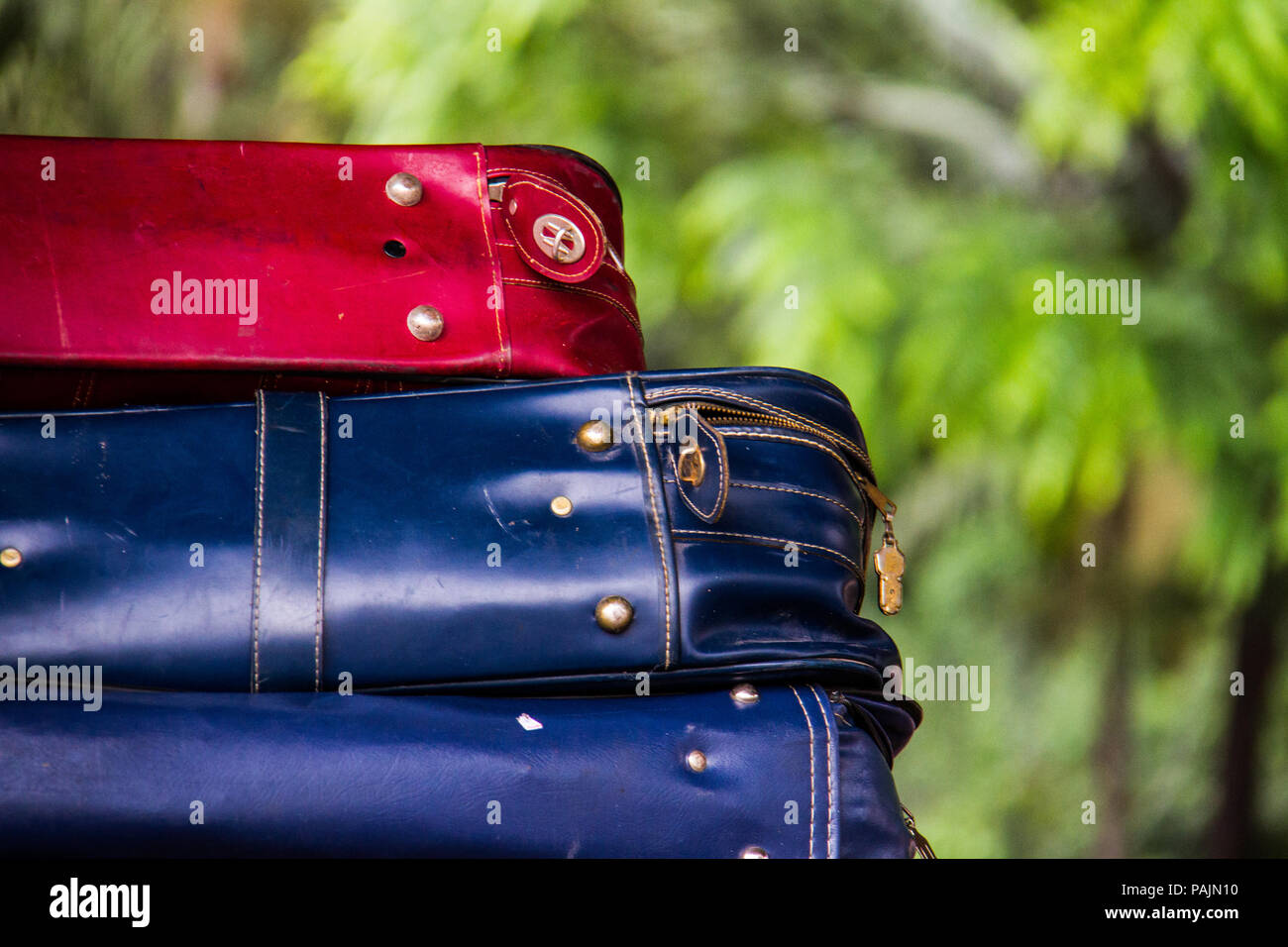 Vintage red and blue leather suitcases Stock Photo - Alamy