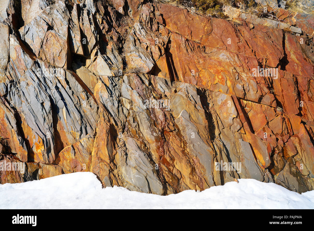 Slate stone texture and snow in Pyrenees of Spain Stock Photo - Alamy