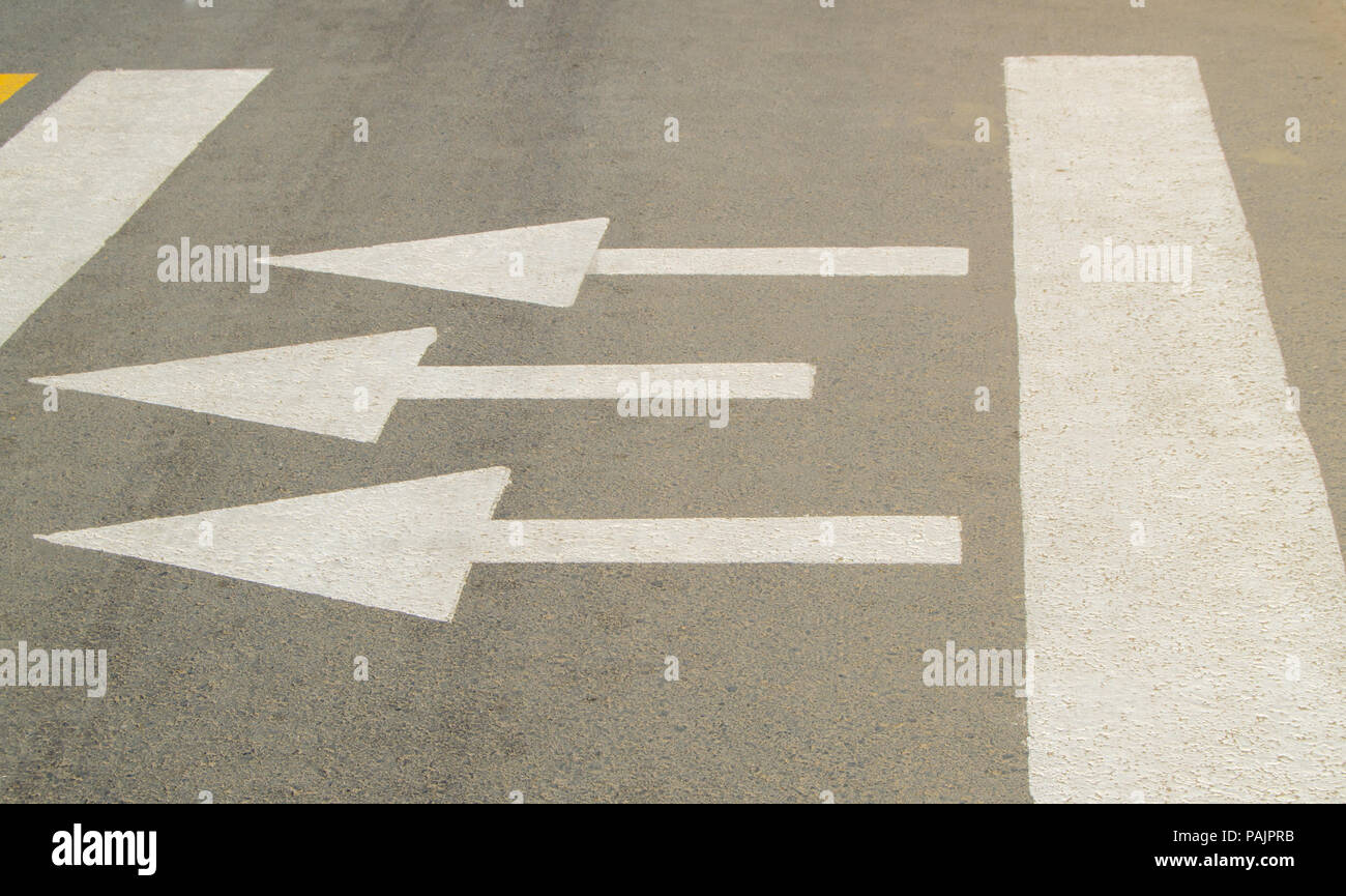 Asphalt road with arrow sign shows the direction of movement Stock ...