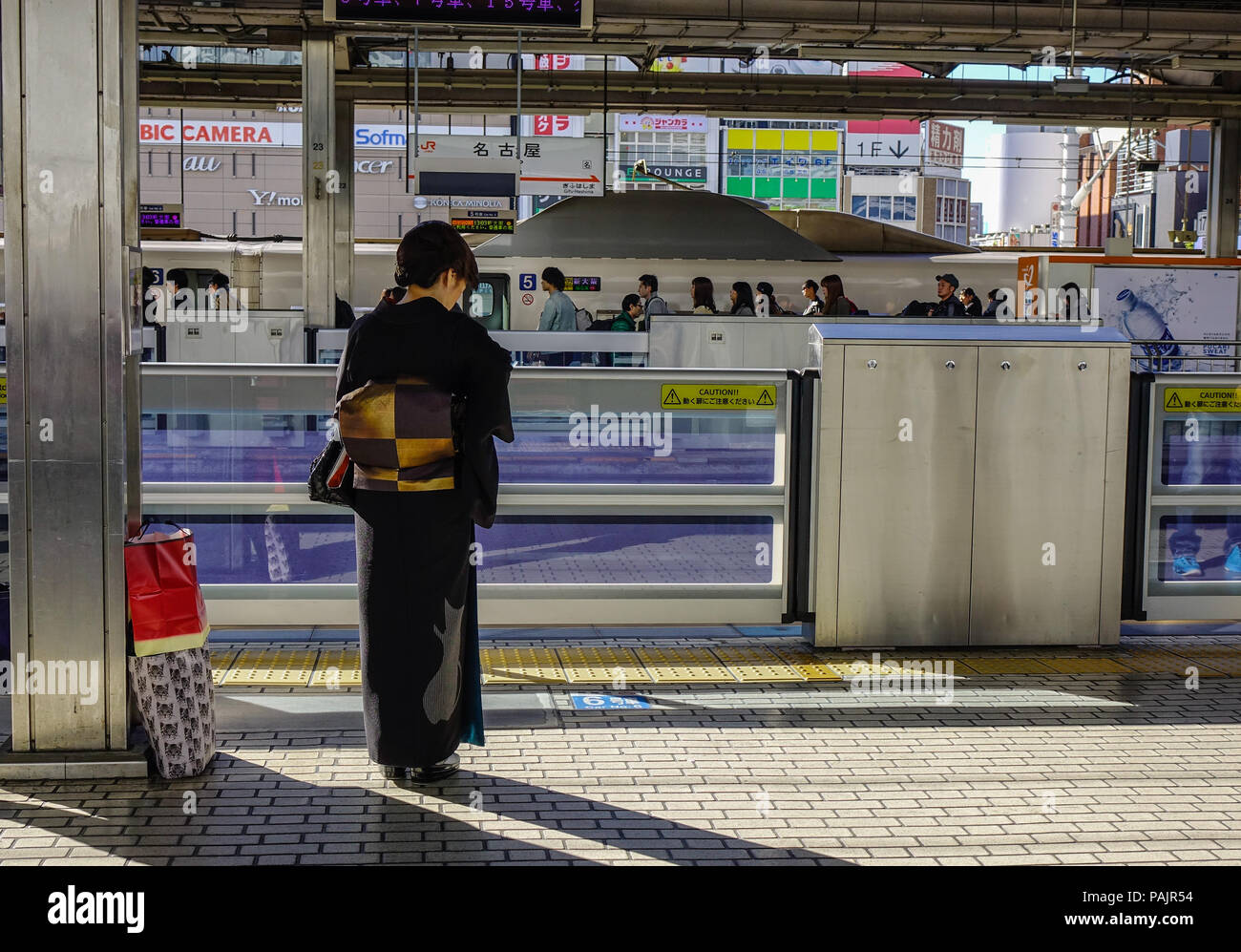 Nagoya, Japan - Dec 3, 2016. A woman in kimono at railway station in ...