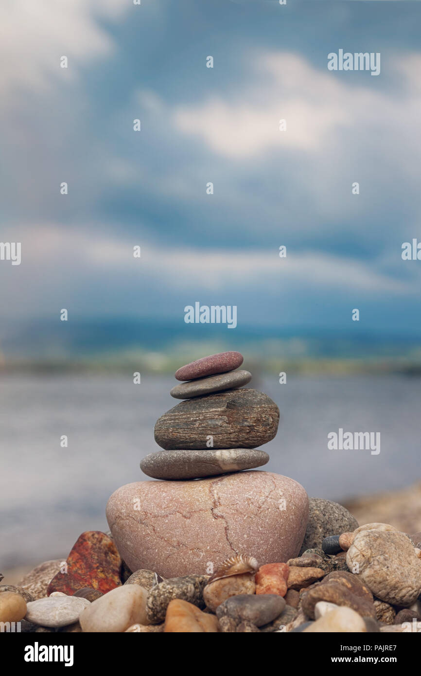 concept of balance and harmony. rocks on the river coast in the nature ...