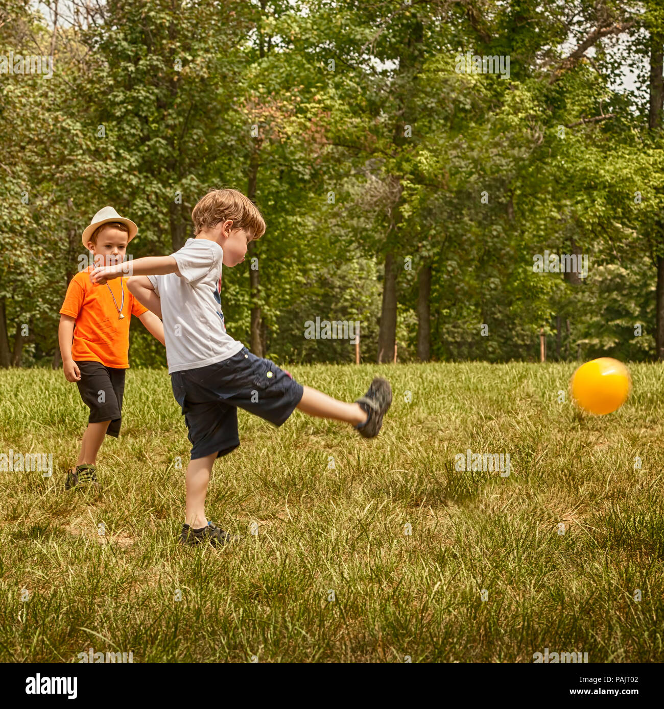 Family kids play soccer together hi-res stock photography and images ...