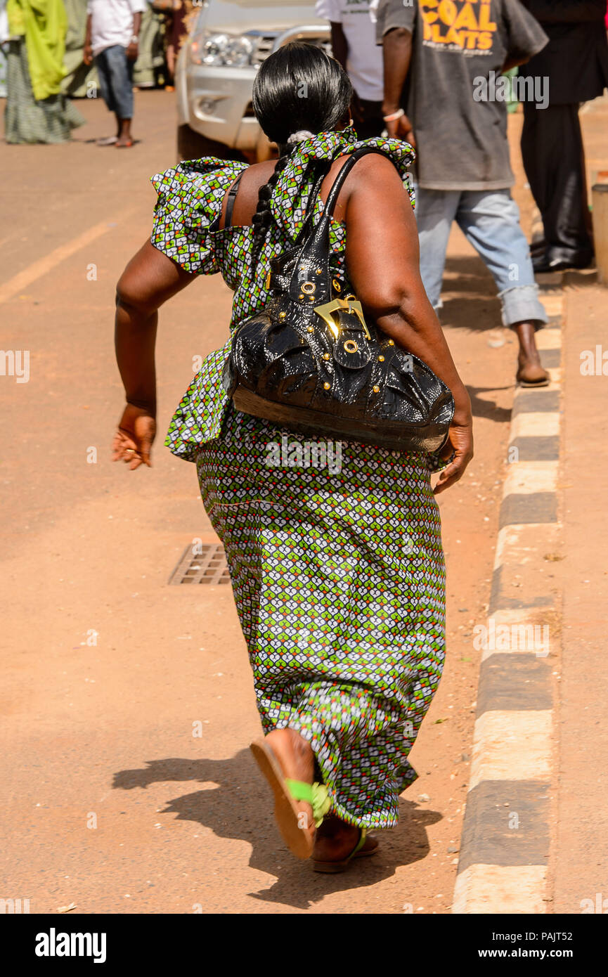 BANJUL, GAMBIA - MAR 14, 2013: Unidentified Gambian funny woman with a ...