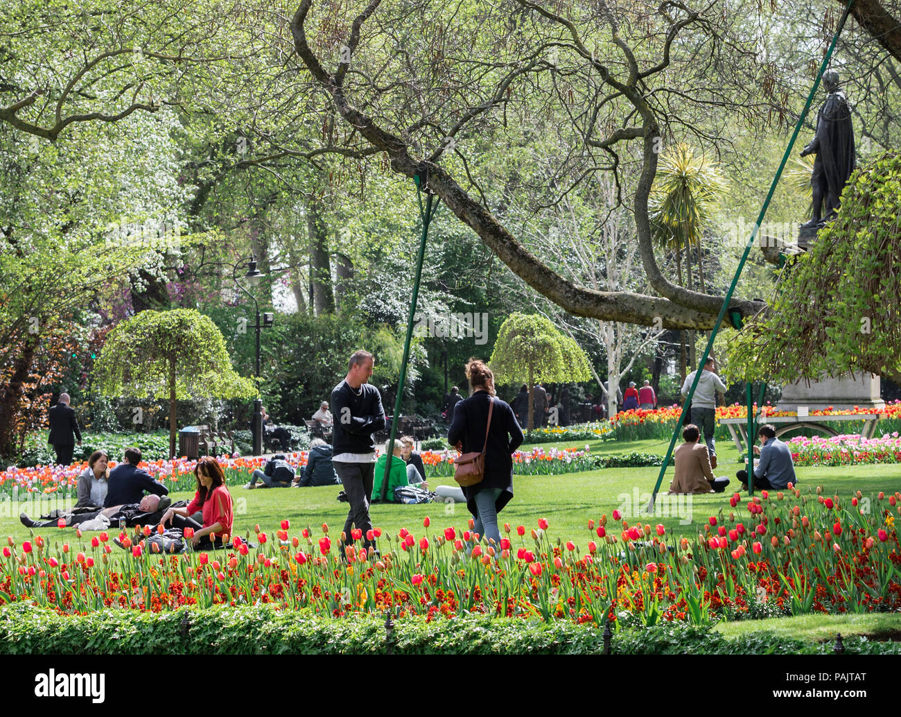 people enjoying a spring day in a public London park Stock Photo - Alamy